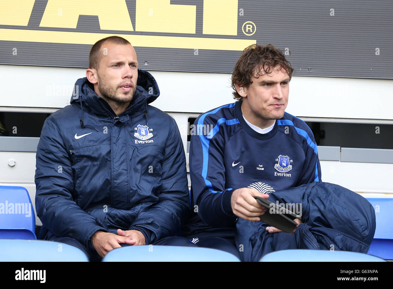 Evertons johnny heitinga left and nikica jelavic on the bench hi-res ...