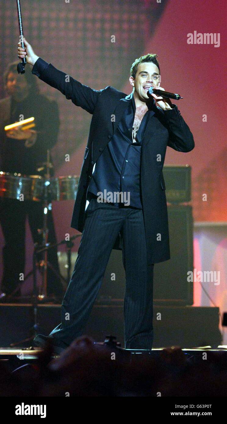 Robbie Williams performing on stage during the MTV Europe Music Awards ...