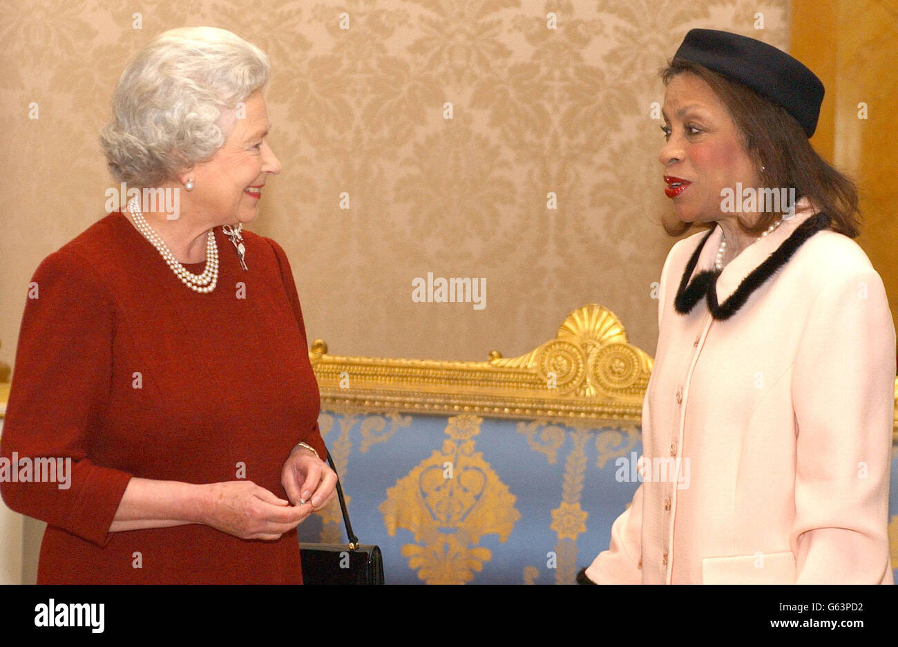 Queen Elizabeth II (left) receives Miss Maxine Roberts on her ...
