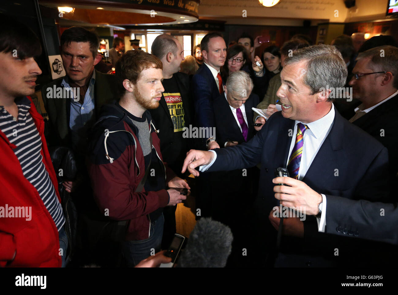 UKIP leader Nigel Farage talks with protesters in the Cannons Gait pub ...