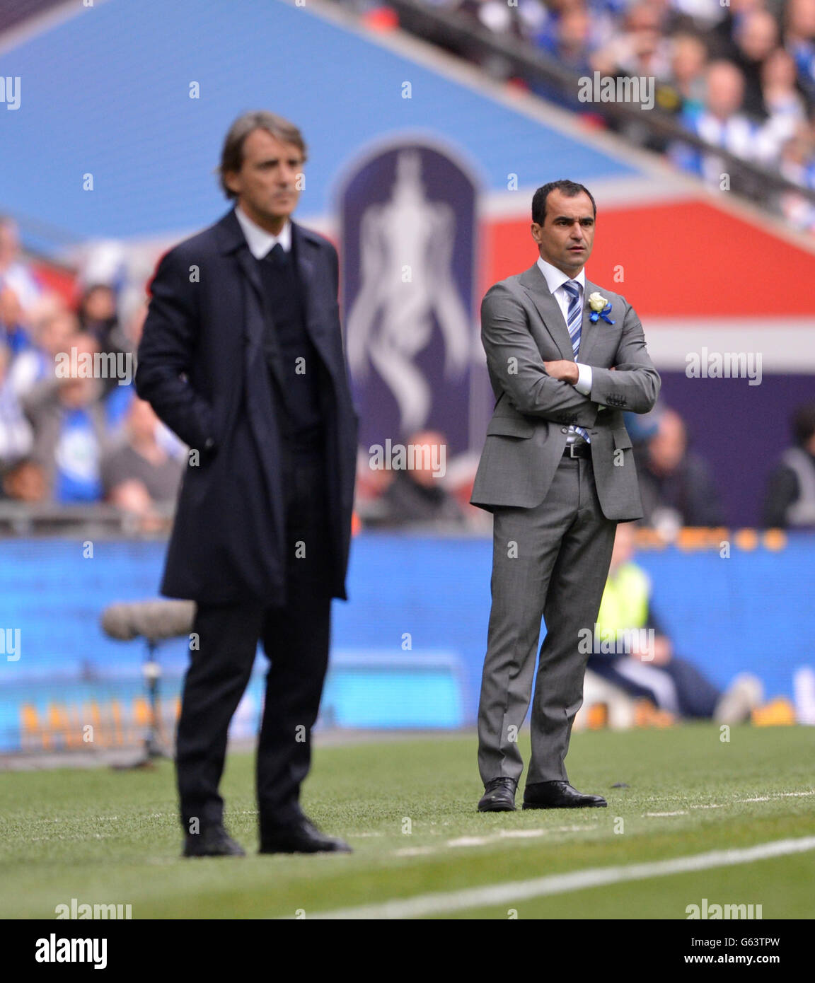 Manchester City manager Roberto Mancini (left) and Wigan Athletic ...