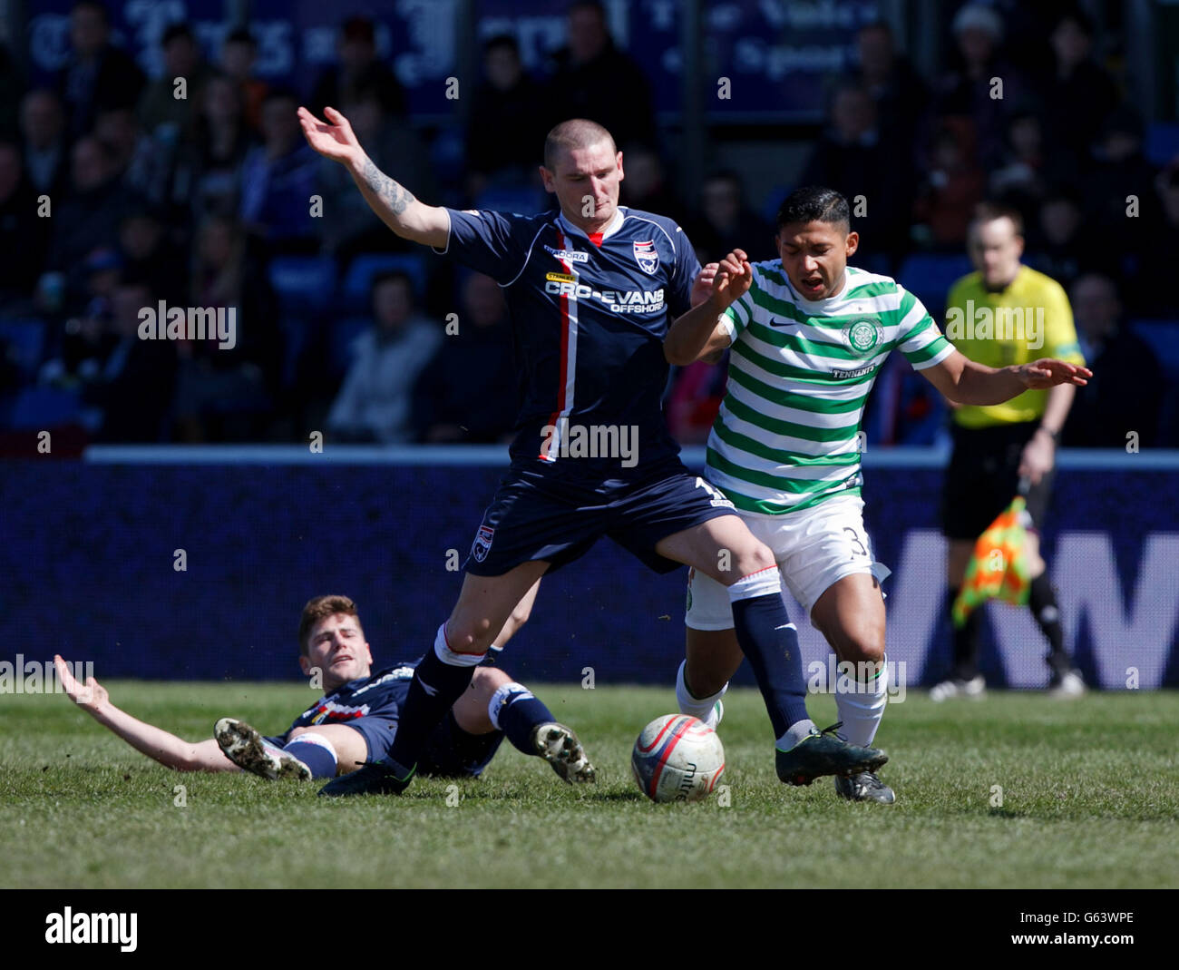 Ross County's Martin Scott tackles Celtic's Emilio Izaguirre during the ...