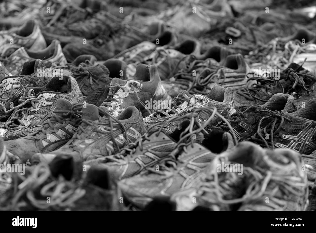 CONVERTED TO BLACK AND WHITE BY PHOTOGRAPHER Discarded trainers at the ...