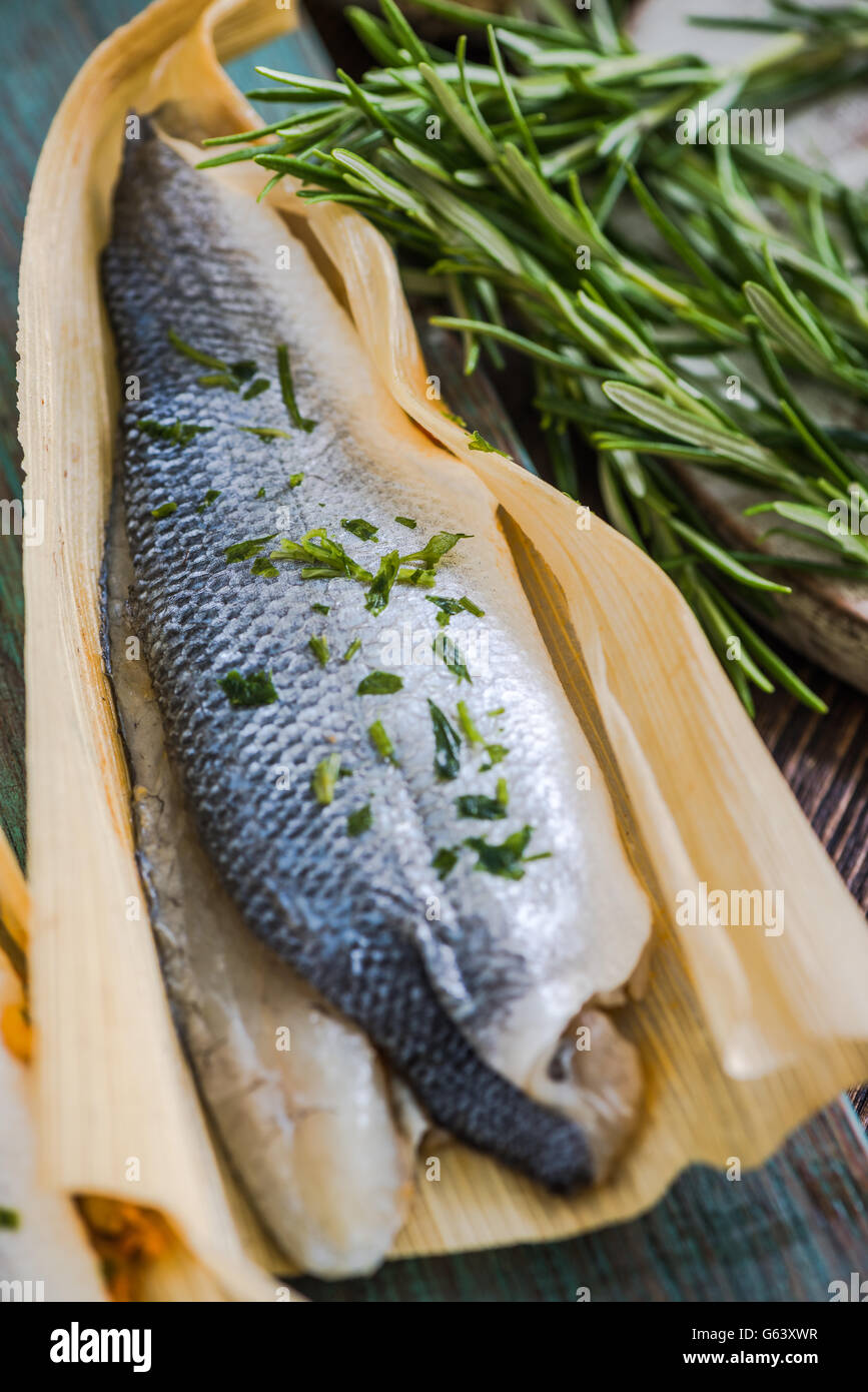 seabass fish with herbs and spices wrapped in corn husk Stock Photo - Alamy