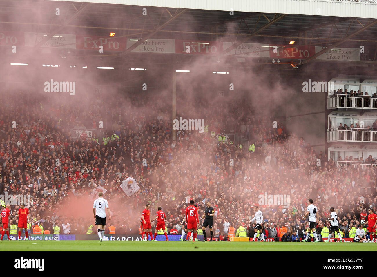 Liverpool fans set off a flare during the match hi-res stock ...