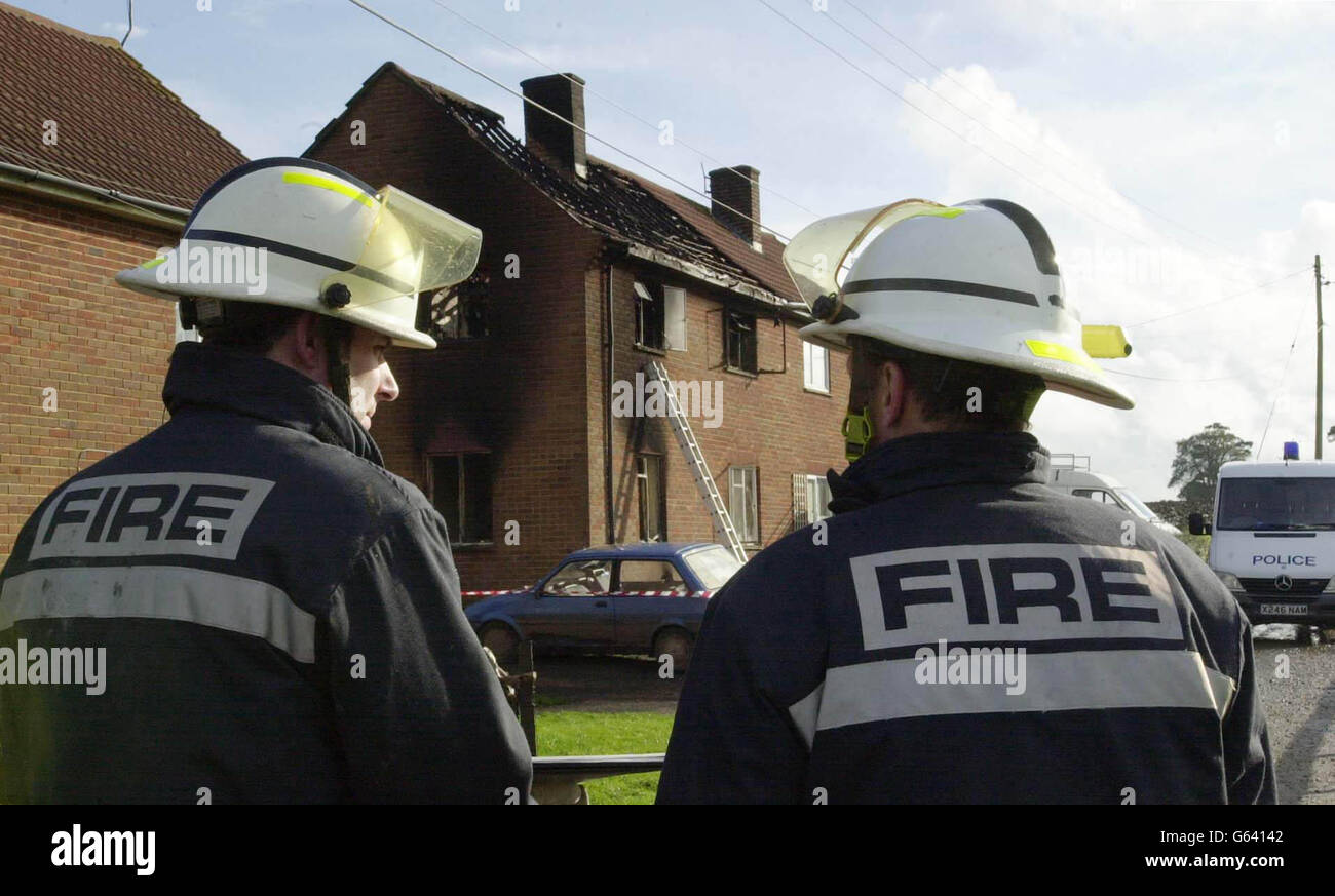 Two firefighters at the scene of a blaze at a cottage close to the ...