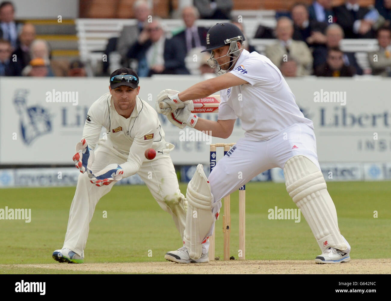 England's Jonathan Trott bats as New Zealand's Brendon McCullum acts as ...