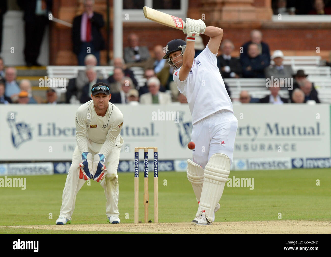 England's Jonathan Trott bats as New Zealand's Brendon McCullum acts as ...