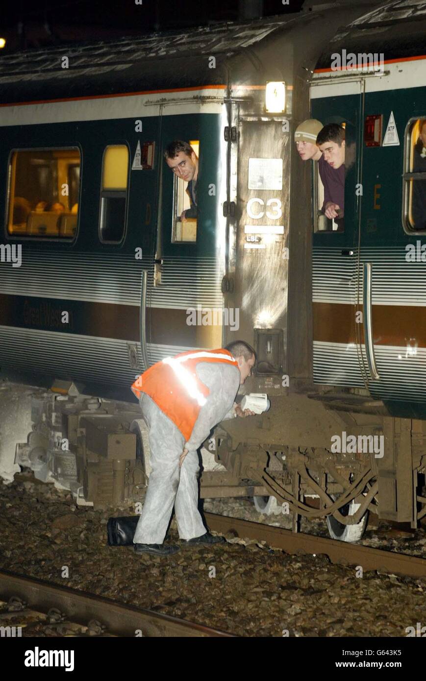 A railway engineer inspects the damage at the scene at West Ealing in ...