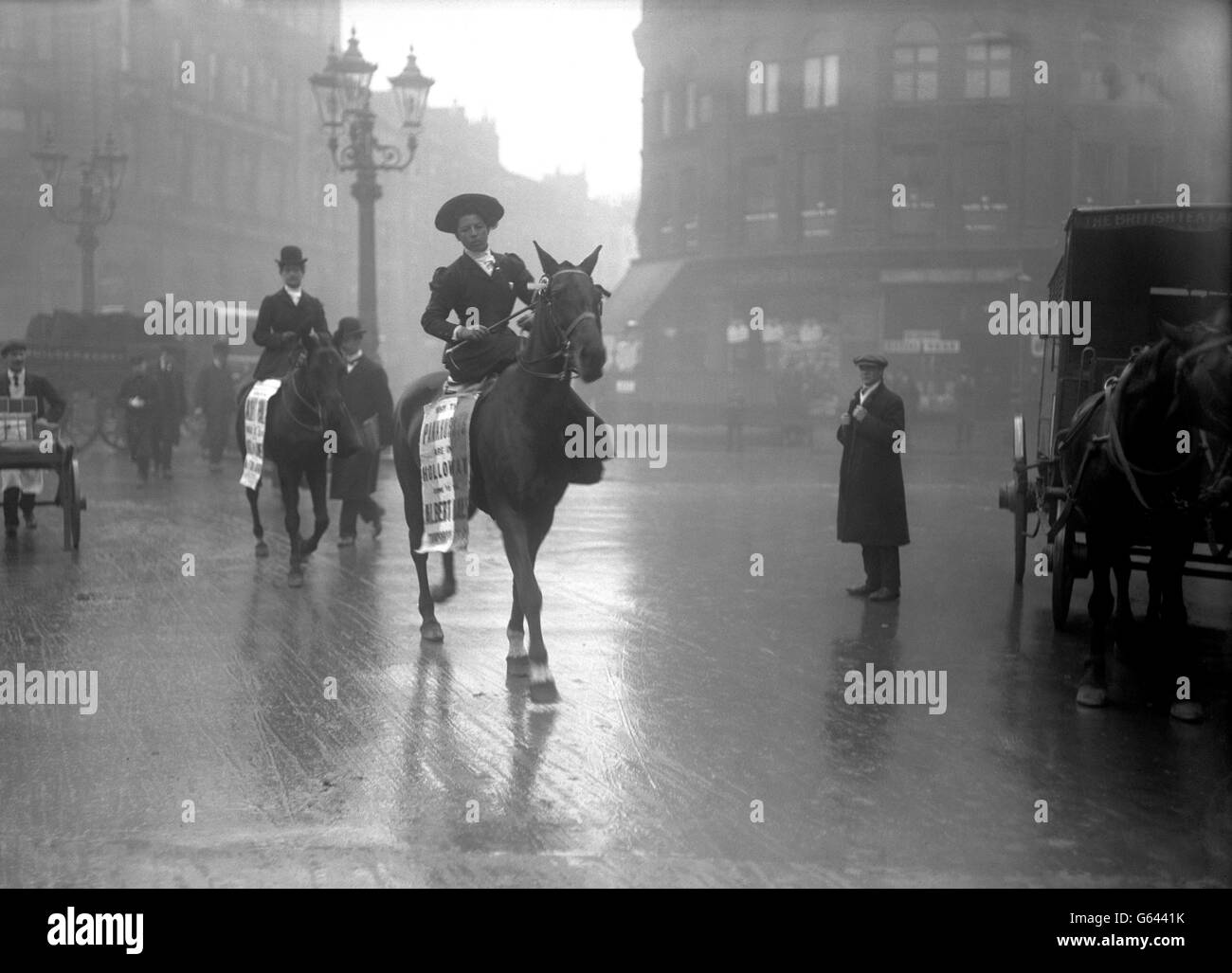 Suffragettes on horseback riding through London. The poster on the ...