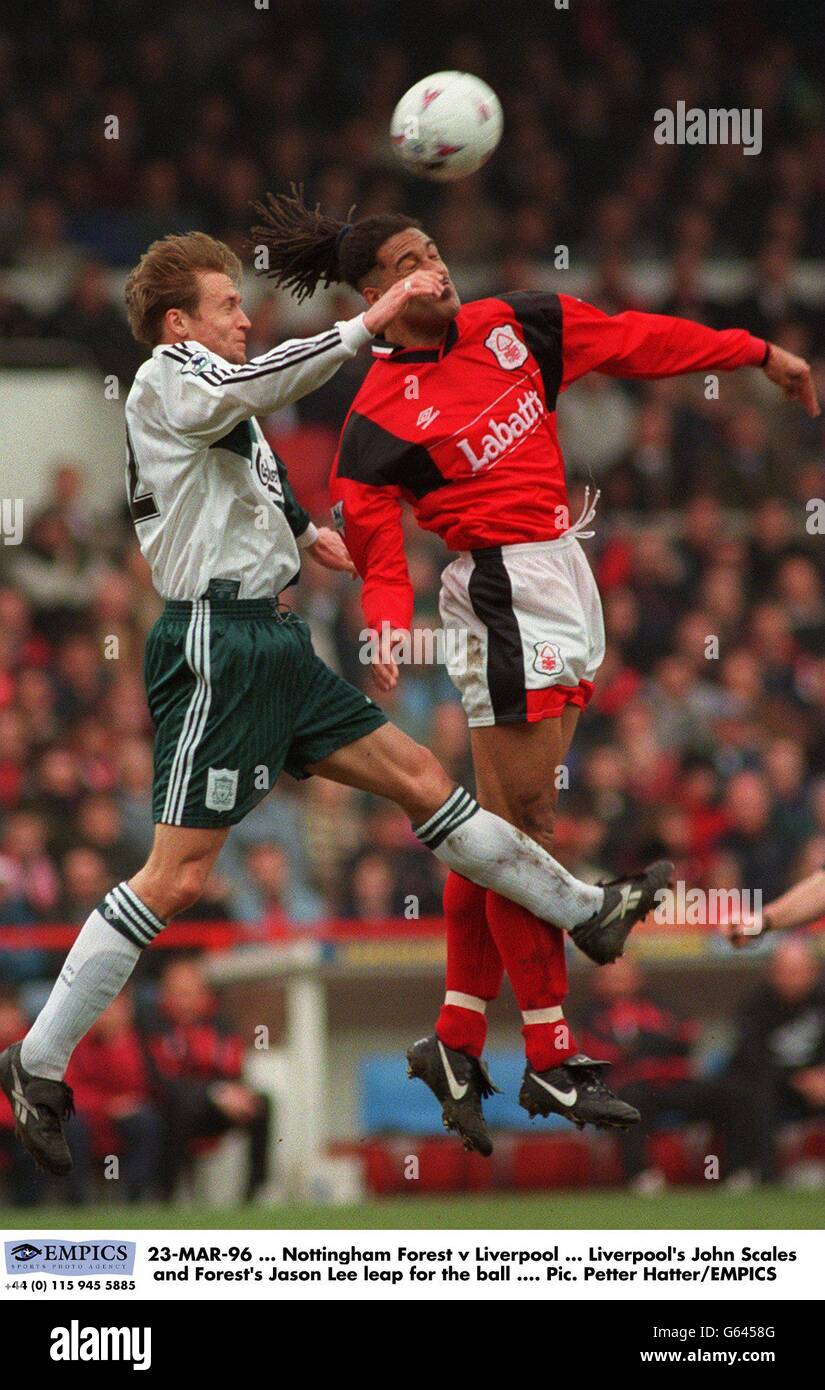 Liverpool's John Scales and Nottingham Forest's Jason Lee leap for the ...