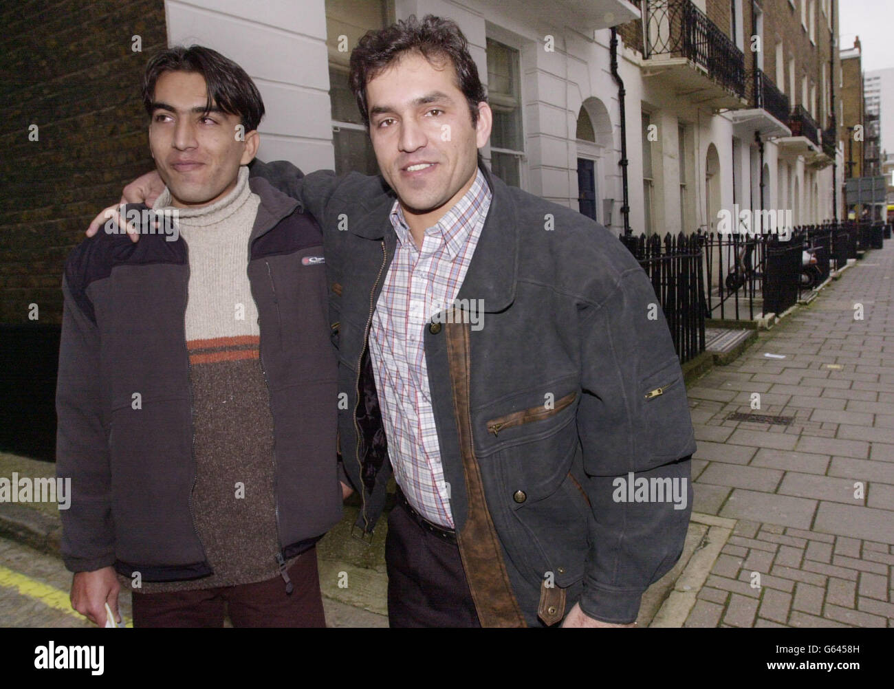 Asylum seeker Amanullah Ahmadzai (left) who arrived from the Sangatte ...