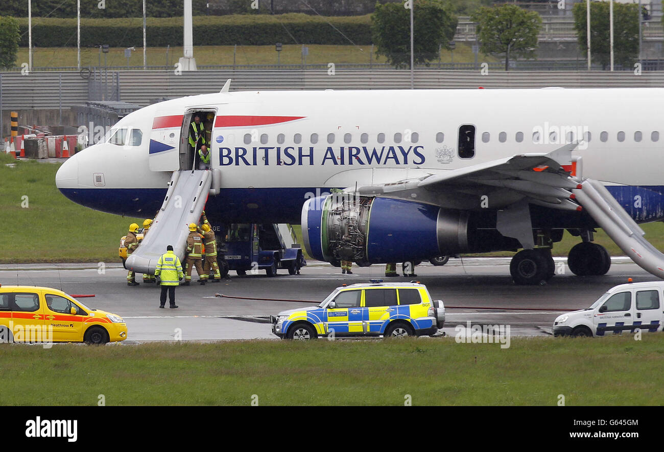 A British Airways plane surrounded by emergency vehicles after it had ...