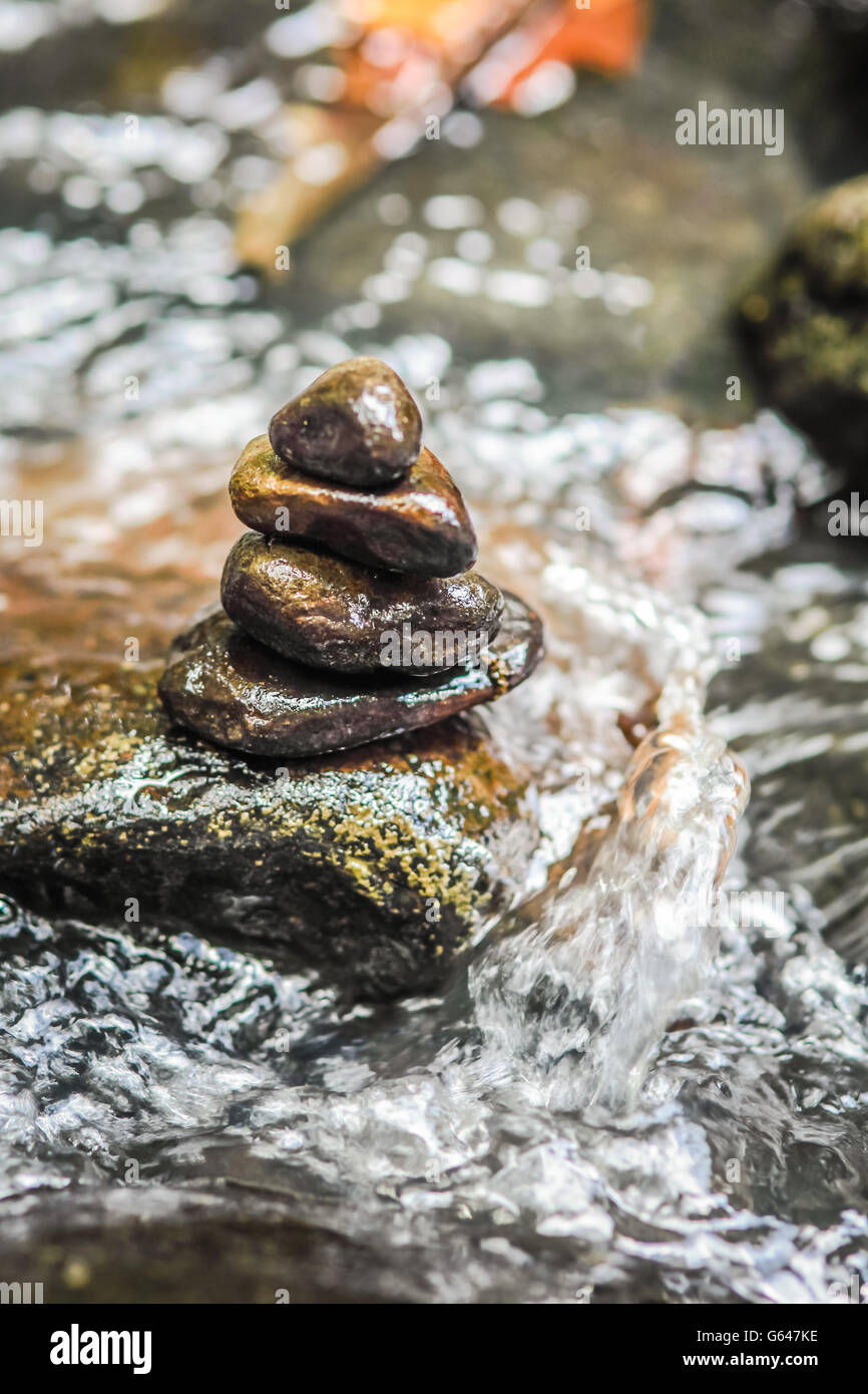 Pebble stones on nature bokeh background - SPA Concept Stock Photo - Alamy