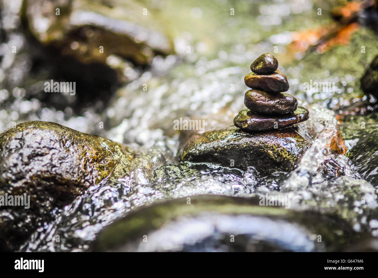 Pebble stones on nature bokeh background - SPA Concept Stock Photo - Alamy