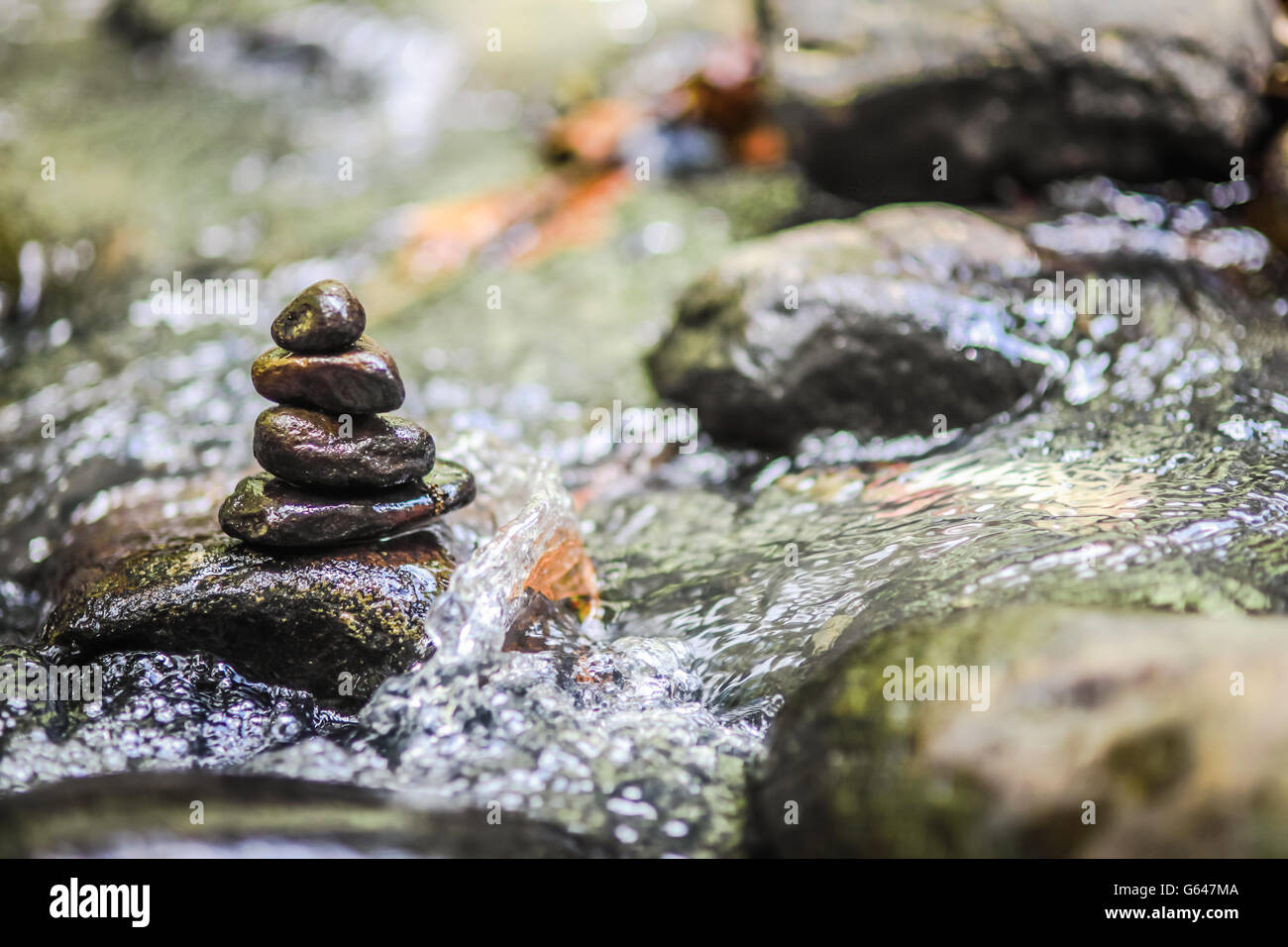 Pebble stones on nature bokeh background - SPA Concept Stock Photo - Alamy