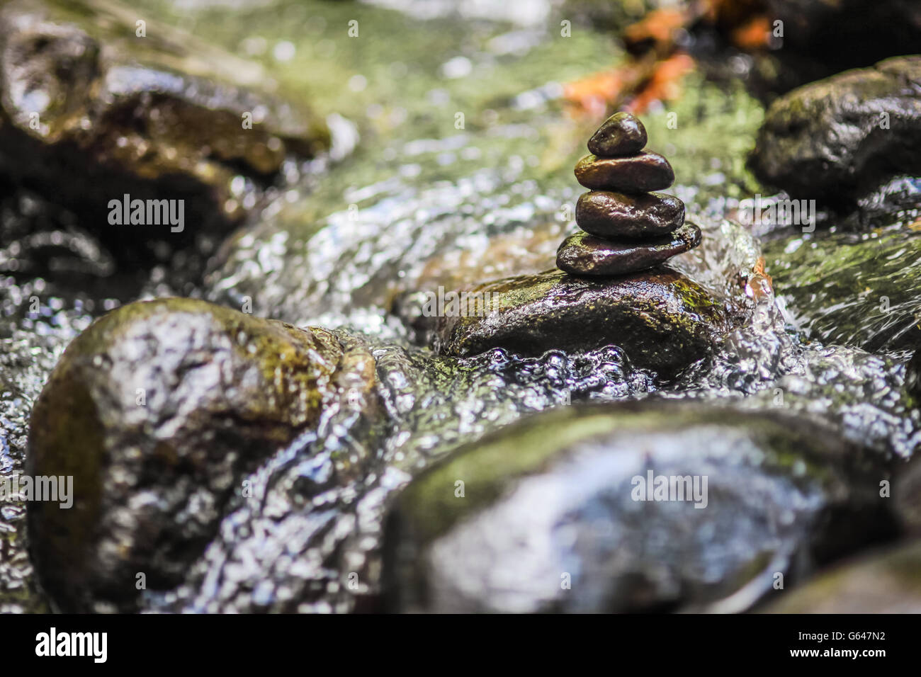Pebble stones on nature bokeh background - SPA Concept Stock Photo - Alamy