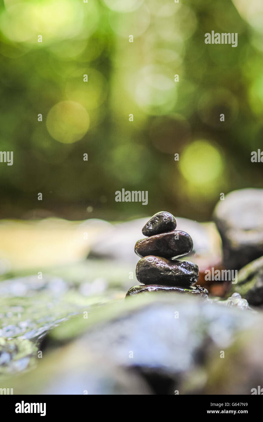 Pebble stones on nature bokeh background - SPA Concept Stock Photo - Alamy