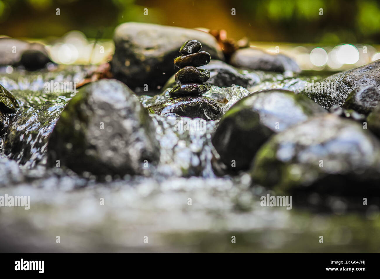 Pebble stones on nature bokeh background - SPA Concept Stock Photo - Alamy