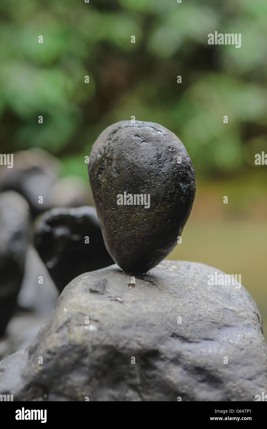 Pebble stones on nature bokeh background - SPA Concept Stock Photo - Alamy