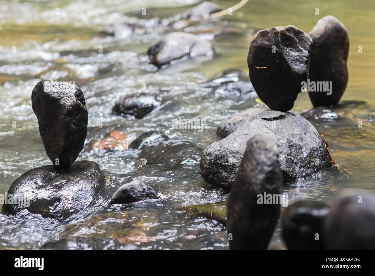 Pebble stones on nature bokeh background - SPA Concept Stock Photo - Alamy
