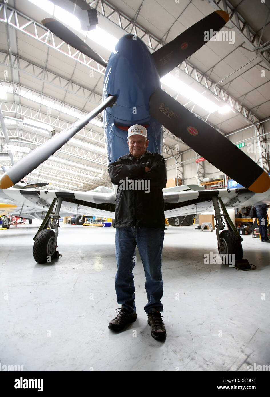 Second World War fighter pilot Bud Anderson, stands alongside a P-51C ...