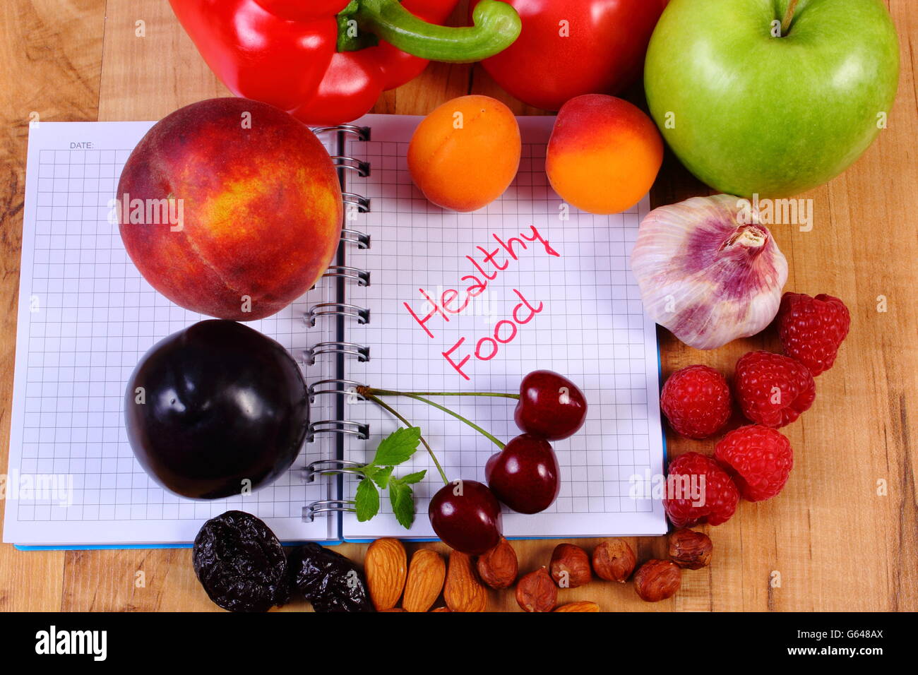 Fresh fruits and vegetables with notebook for writing notes, concept of ...
