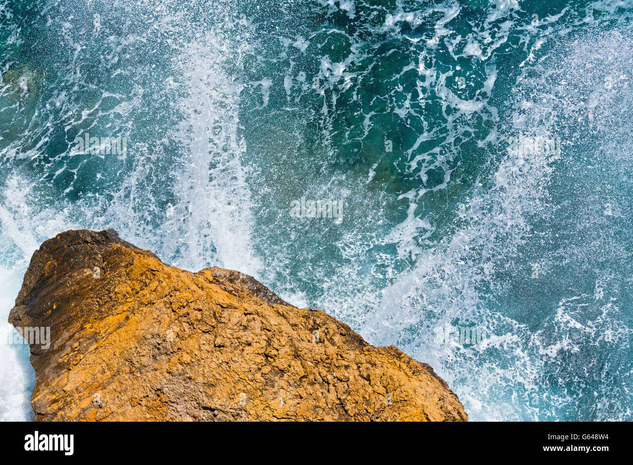 Waves breaking on rocky coast. View from above Stock Photo - Alamy