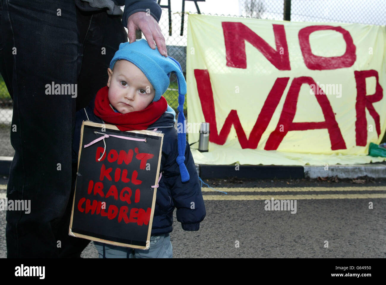 Jordan Vigay, 21 months old, from Portsmouth demonstrates against war ...