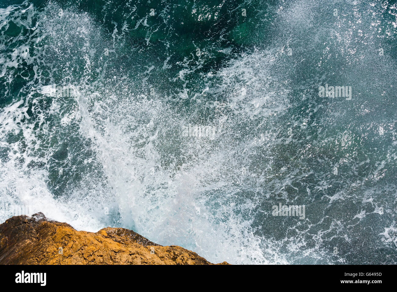 Waves breaking on rocky coast. View from above Stock Photo - Alamy