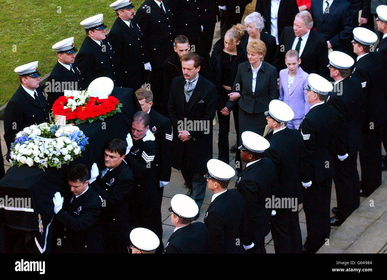 The family of murdered policeman Stephen Oake follow his coffin after ...
