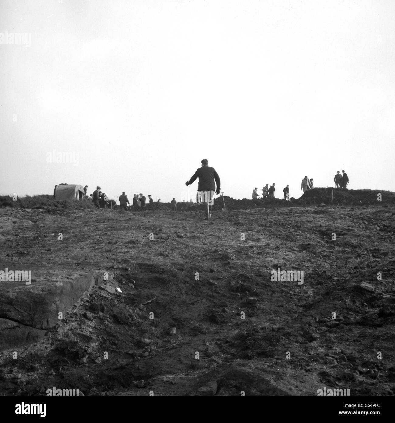 A large team of police officers start digging for hidden graves on ...