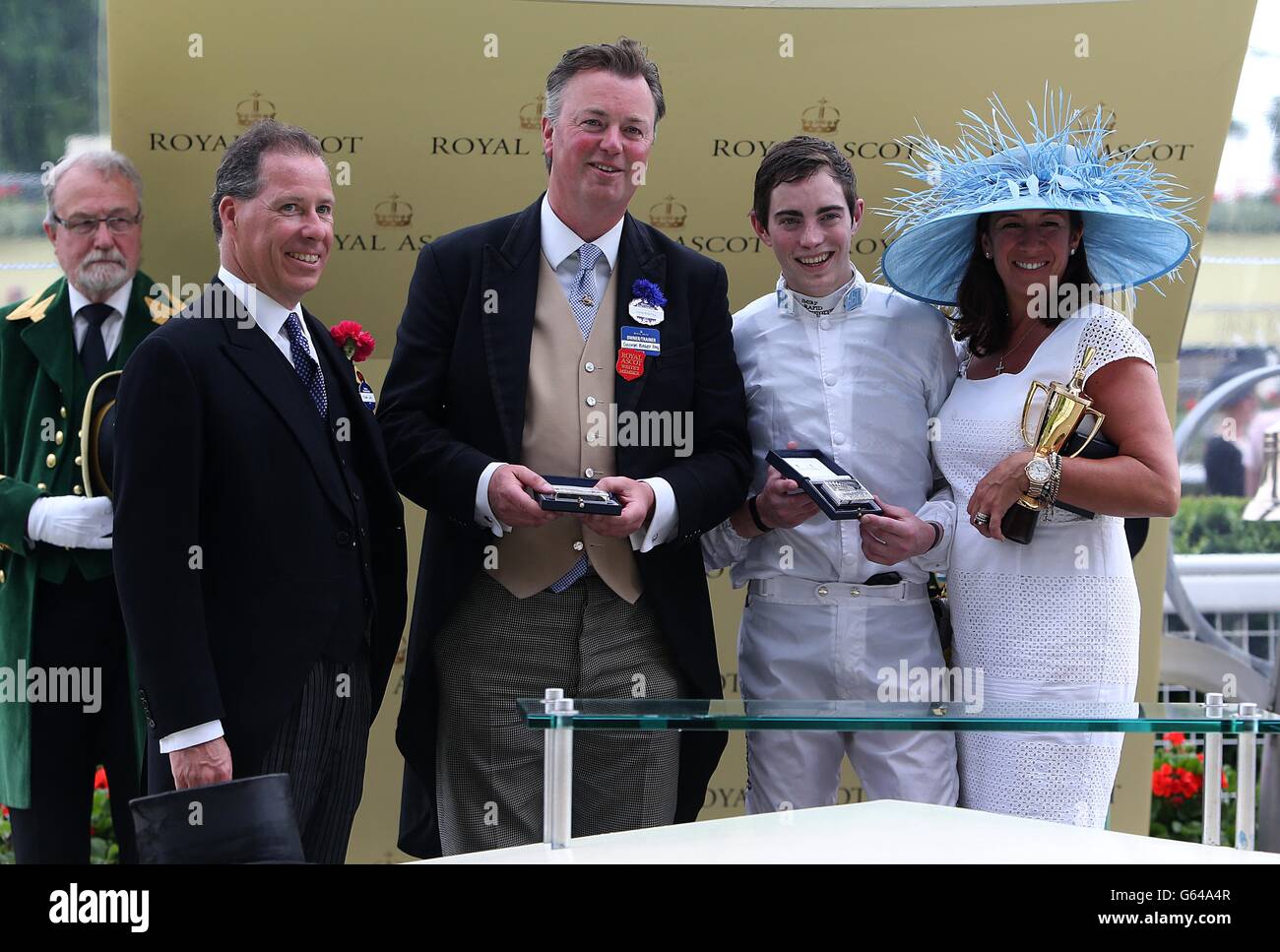 Viscount Linley (left) presents the trophy to Jockey James Doyle after ...