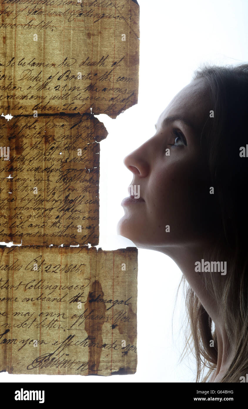 Staff member Lydia Stoker looks at a letter valued at £800 from a ...