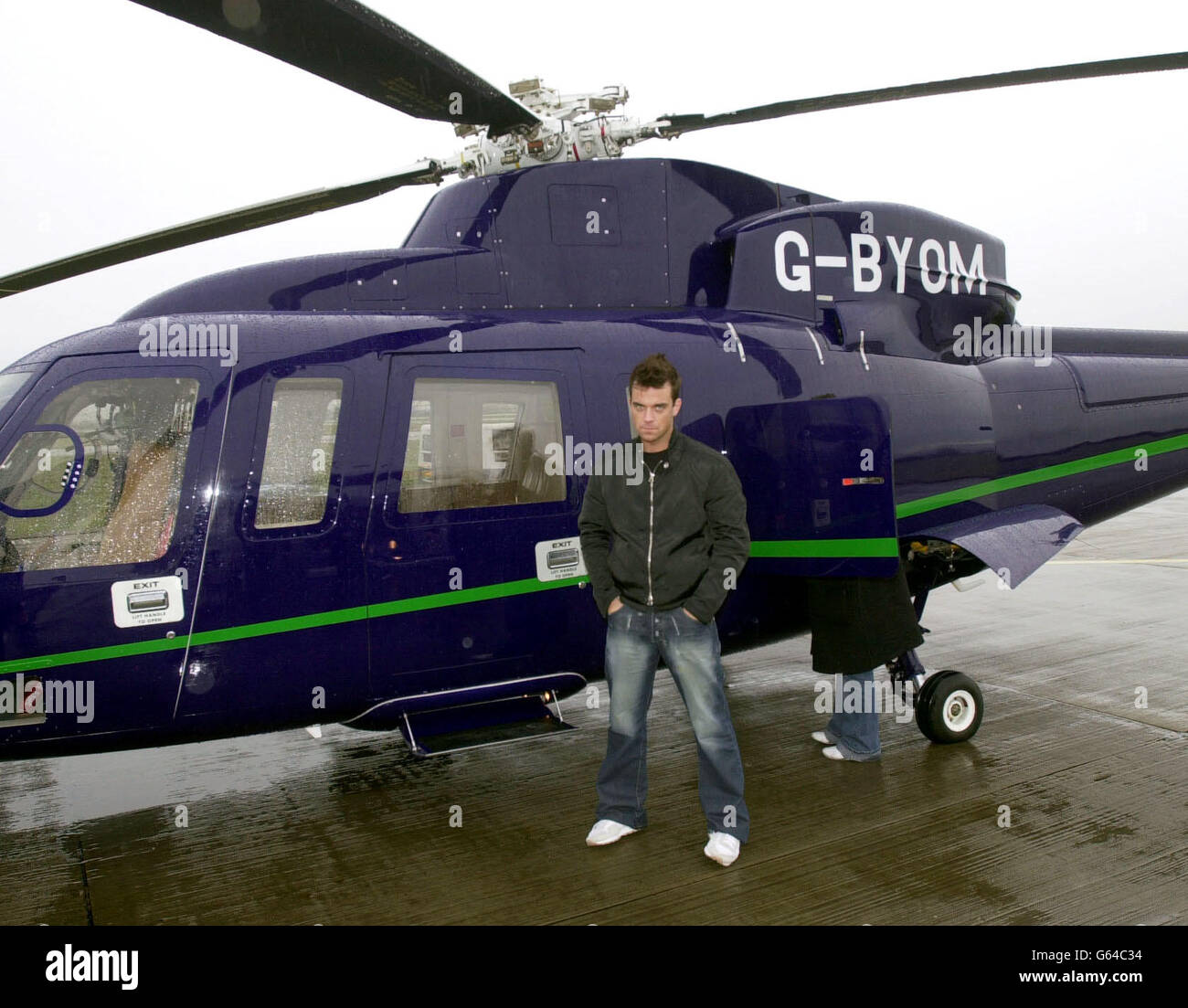 Singer Robbie Williams before boarding a helicopter to leave Glasgow on ...