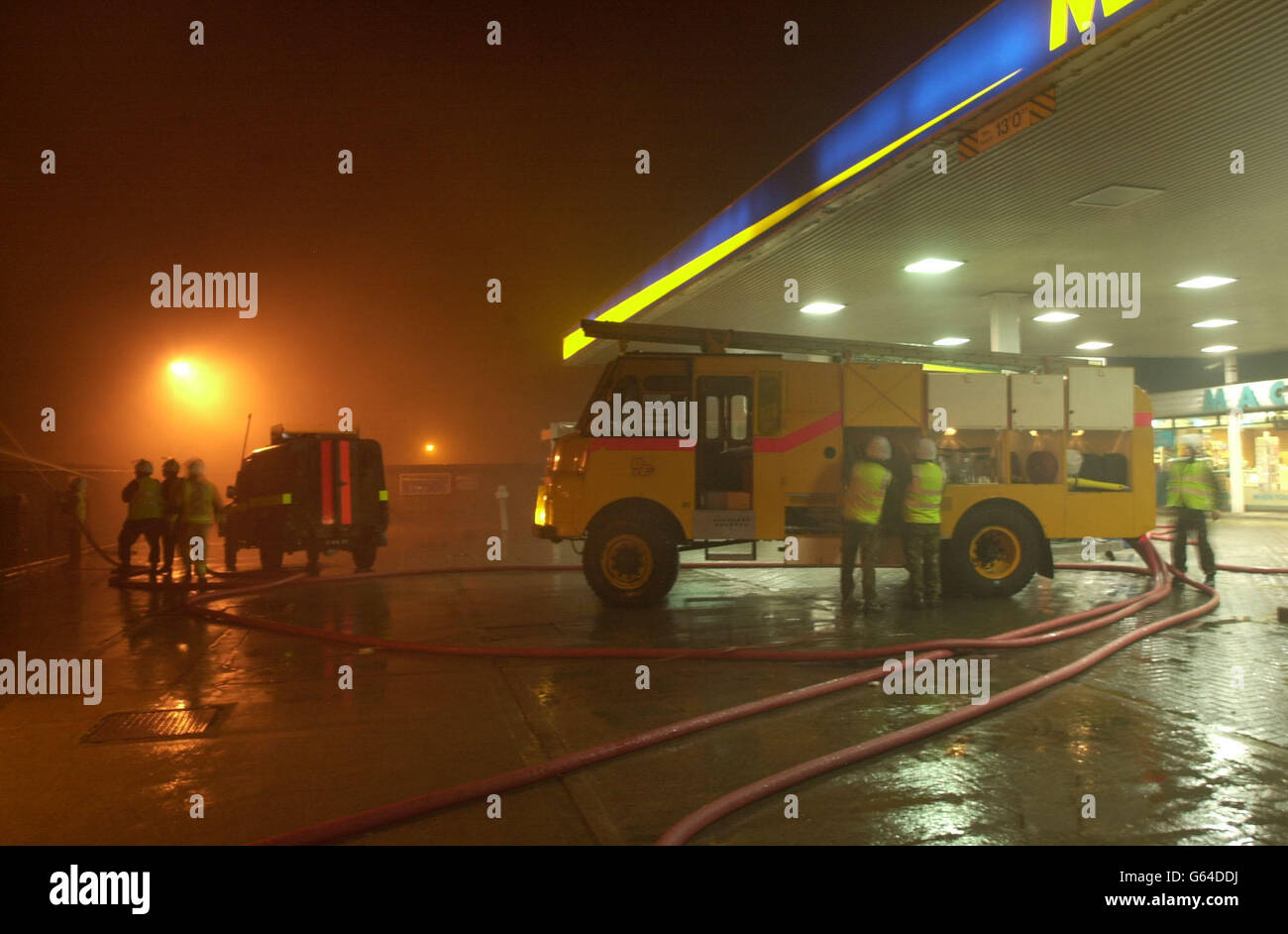 A military fire fighting crew put out a fire in a disused cinema on the ...