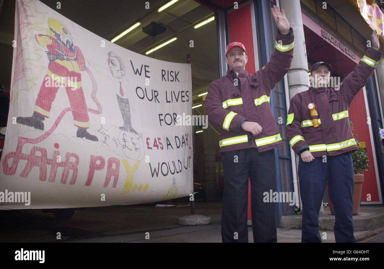 Firefighters Dave Clarke and Bec Bray acknowledge motorists sounding ...