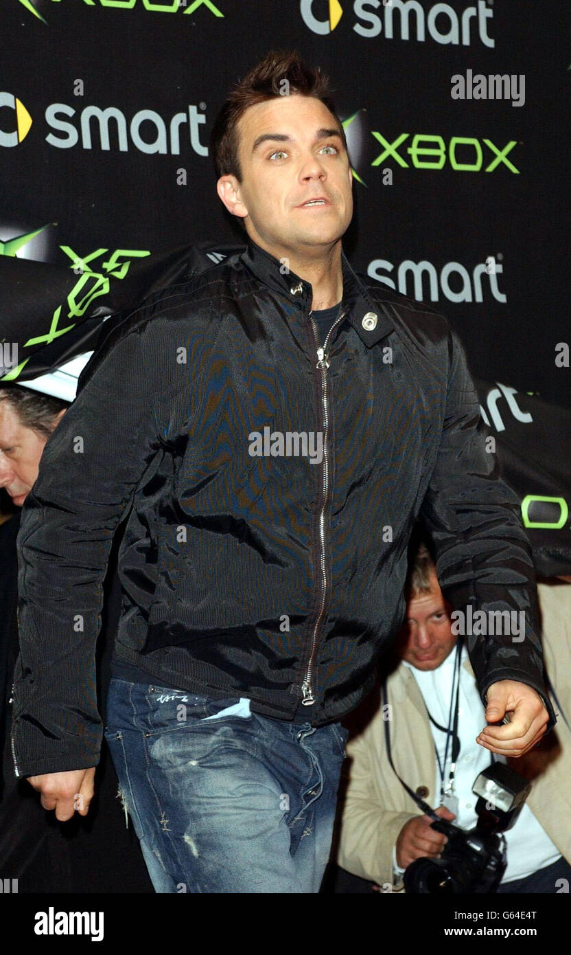 Singer Robbie Williams poses for the media during a photocall in Berlin ...