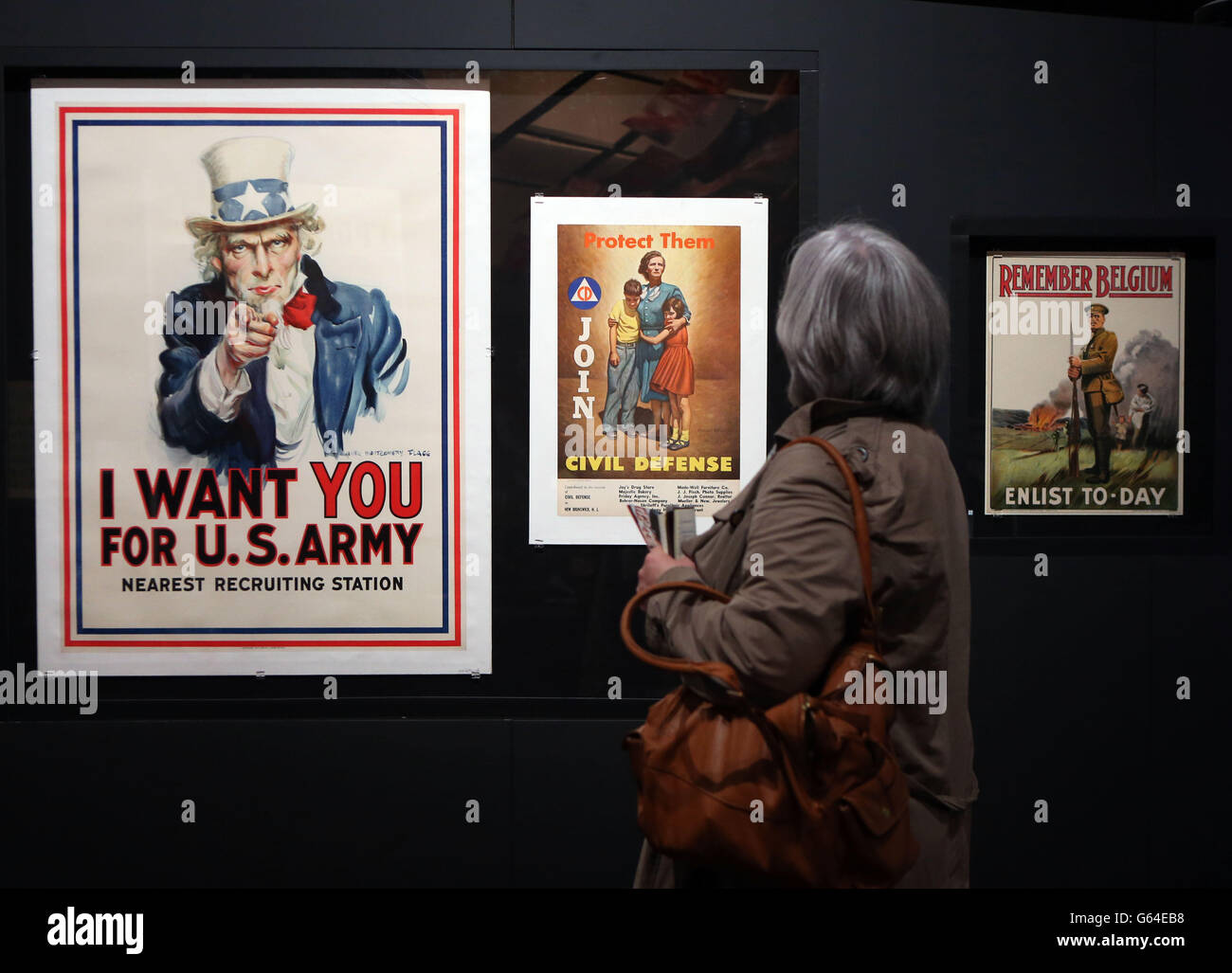 A woman views a US Army poster which is on display as part of the ...