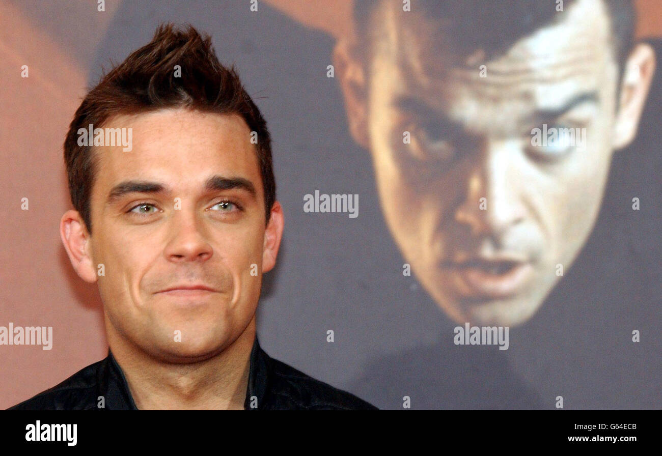 Singer Robbie Williams poses for the media during a photocall in Berlin ...