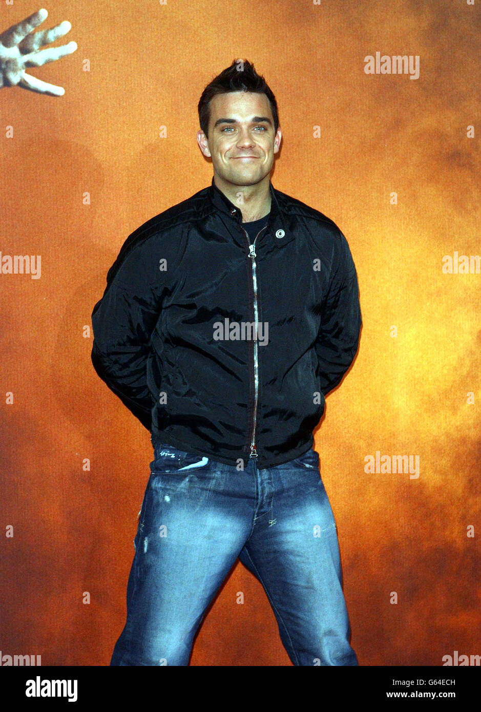 Singer Robbie Williams poses for the media during a photocall in Berlin ...