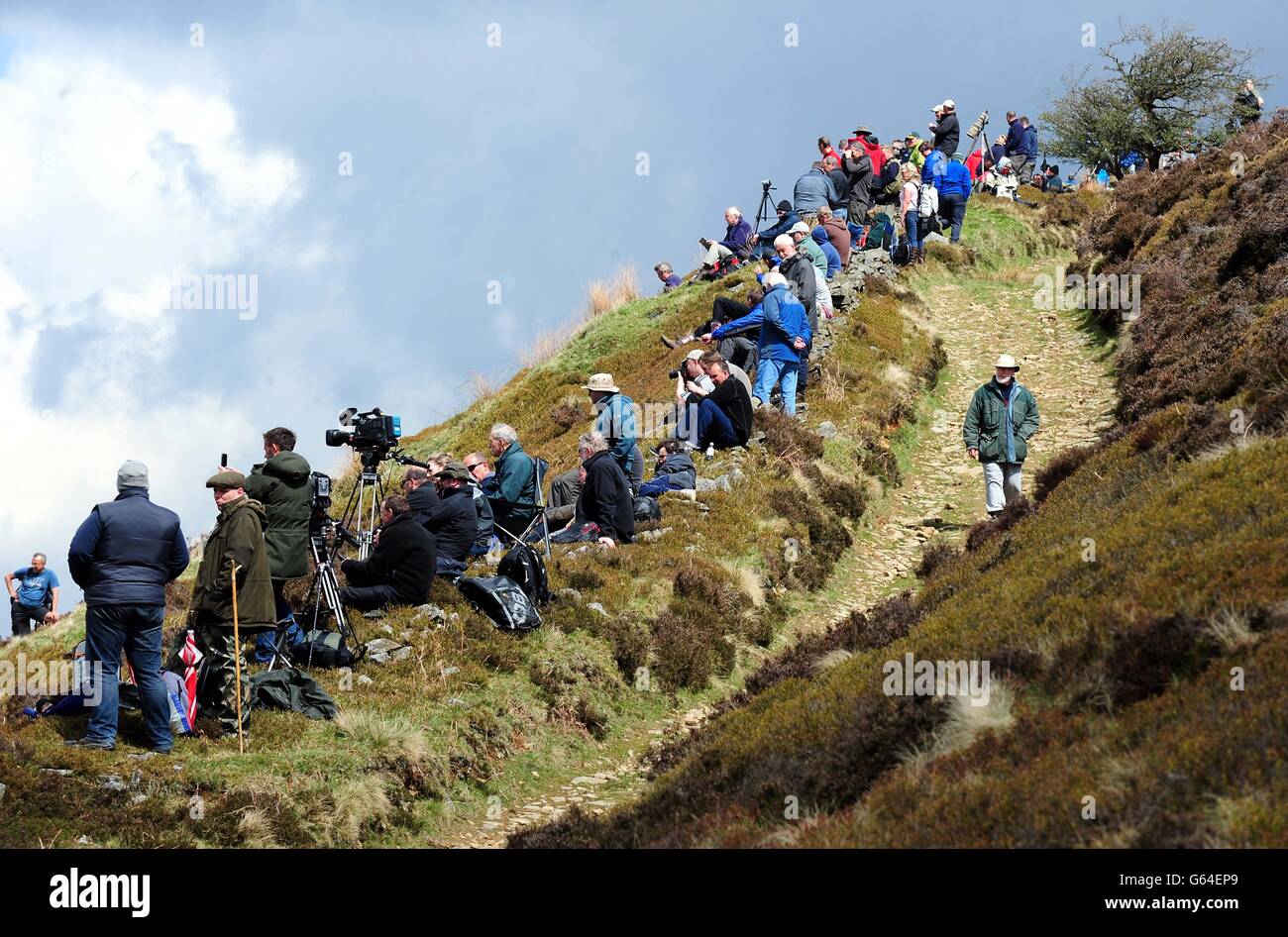 Spectators wait for the Battle of Britain Memorial Flight flypast over ...