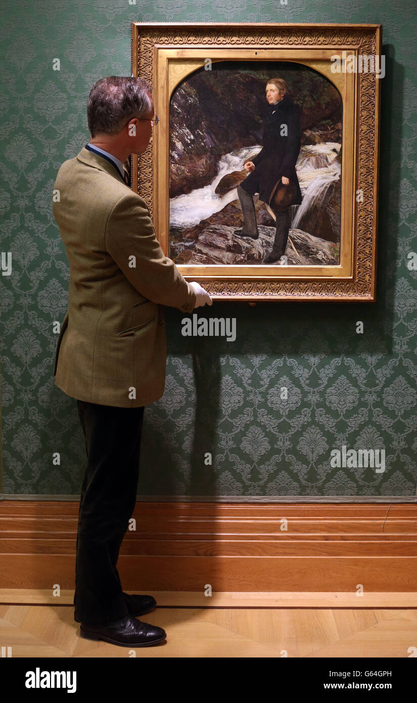 Colin Harrison who is Senior Curator of European Arts adjusts a ...