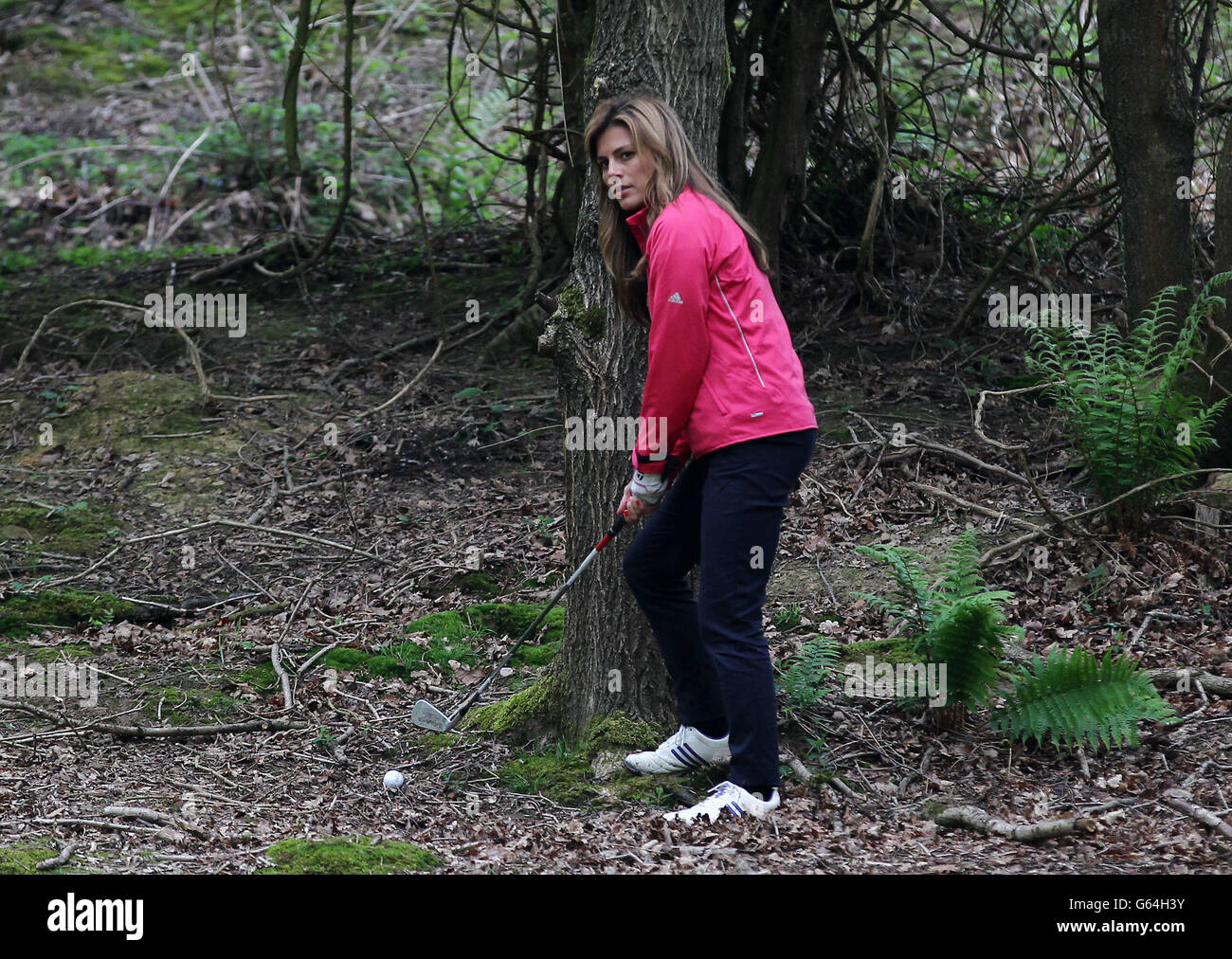 Zoe Hardman chips out of the woods during The Mike Tindall Celebrity ...