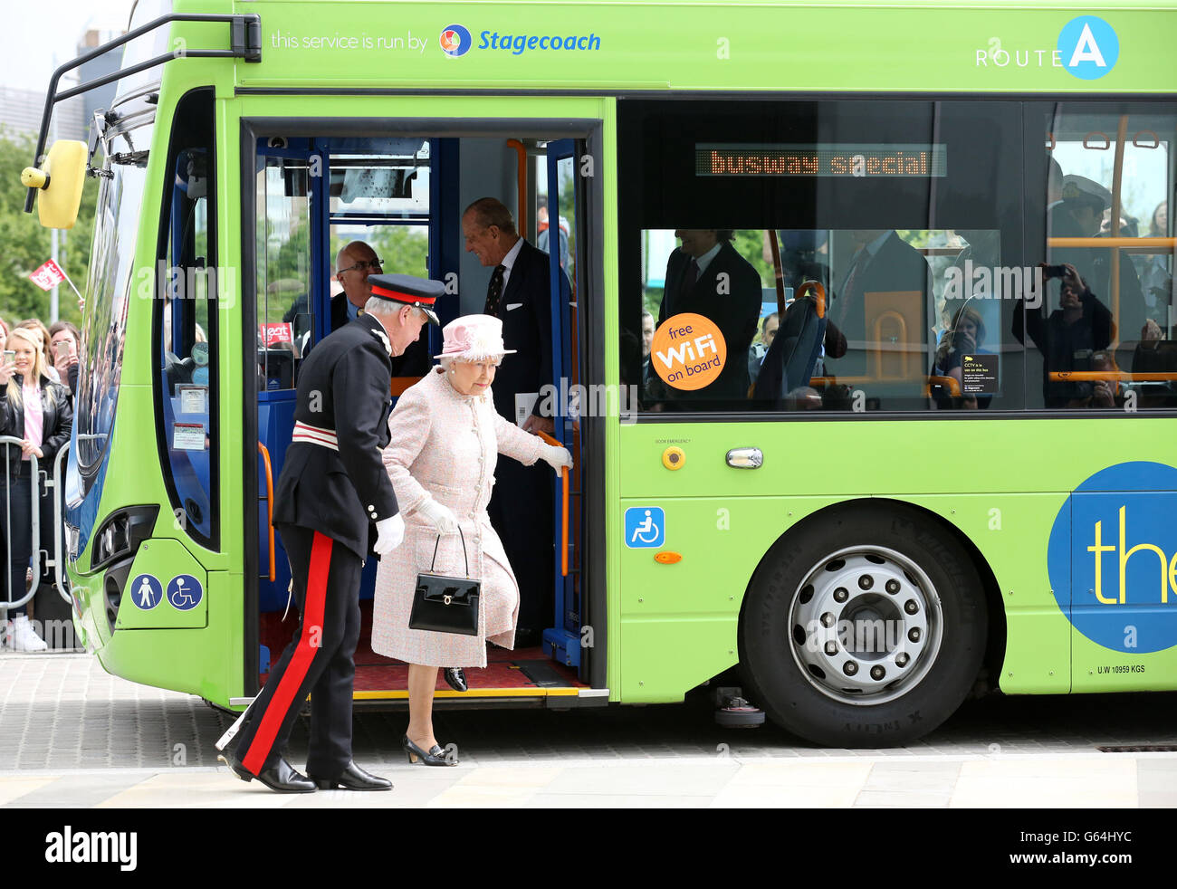 Queen Elizabeth II arrives by guided bus at the Medical Research ...