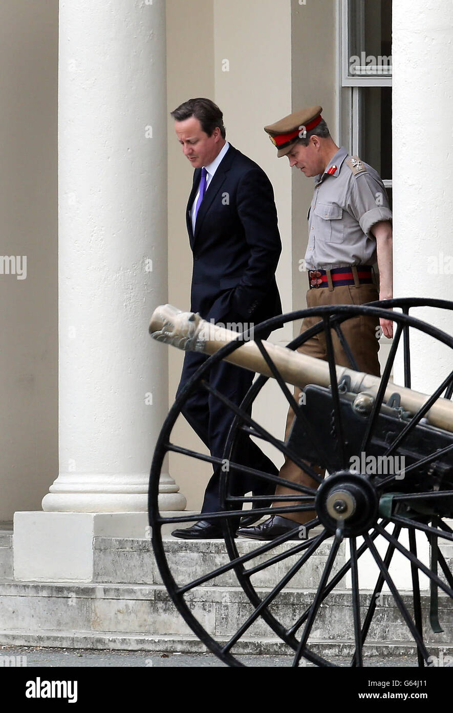 Prime Minister David Cameron leaves Woolwich Barracks in London ...