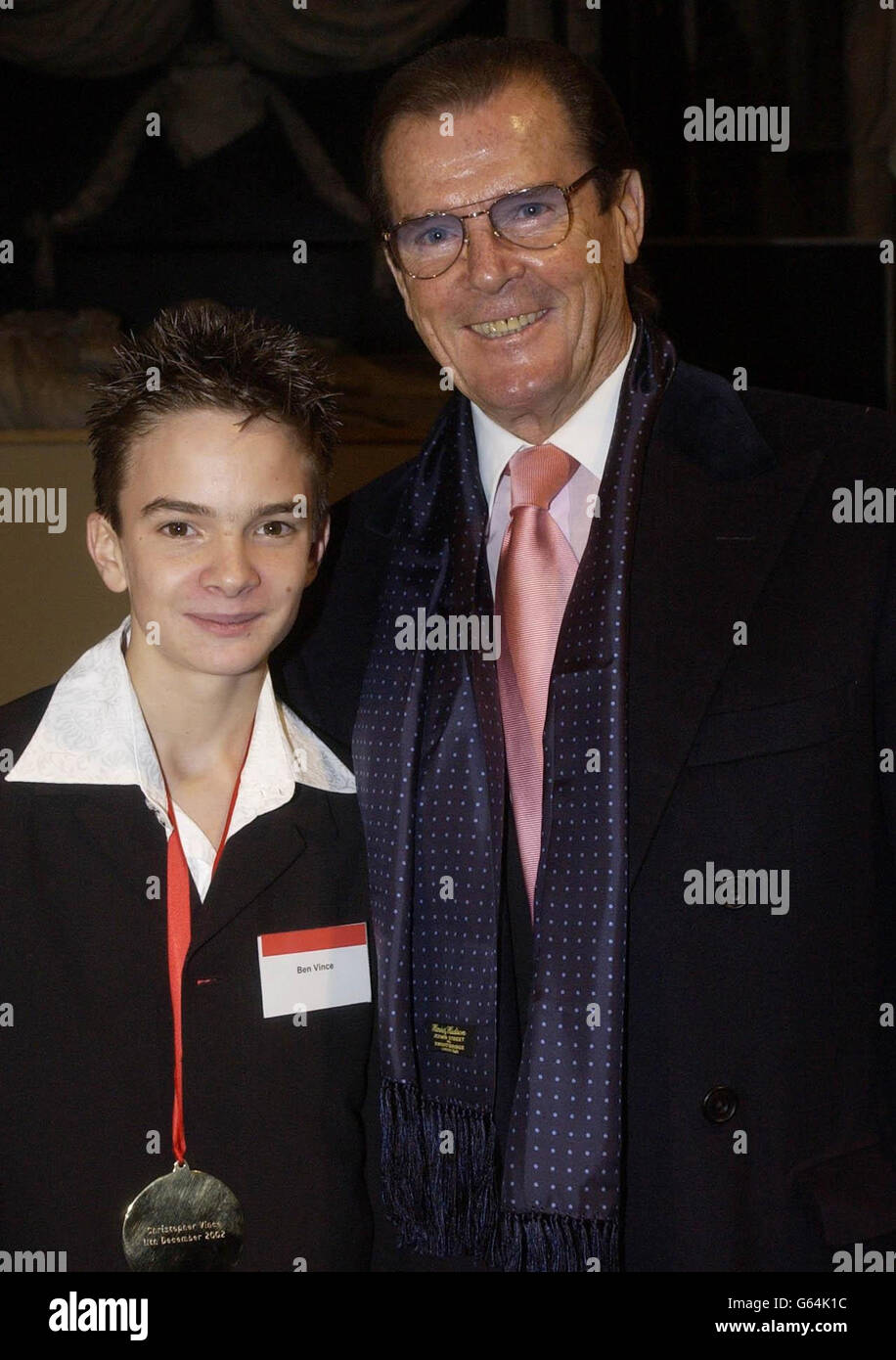 Ben Vince, aged 12 from Norwich poses with former 007 Roger Moore at ...