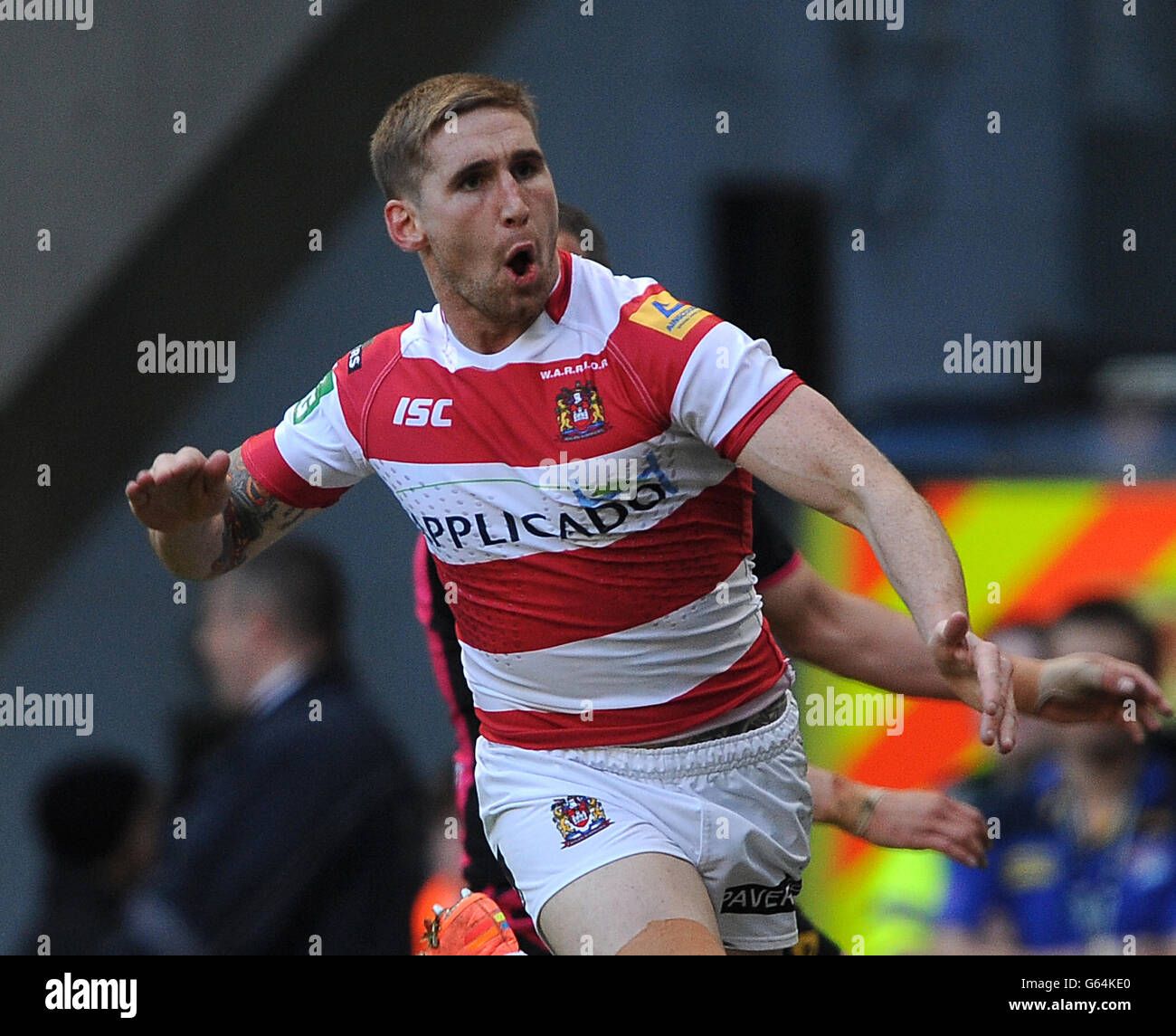 Wigan Warriors' Sam Tomkins celebrates after scoring the opening try ...