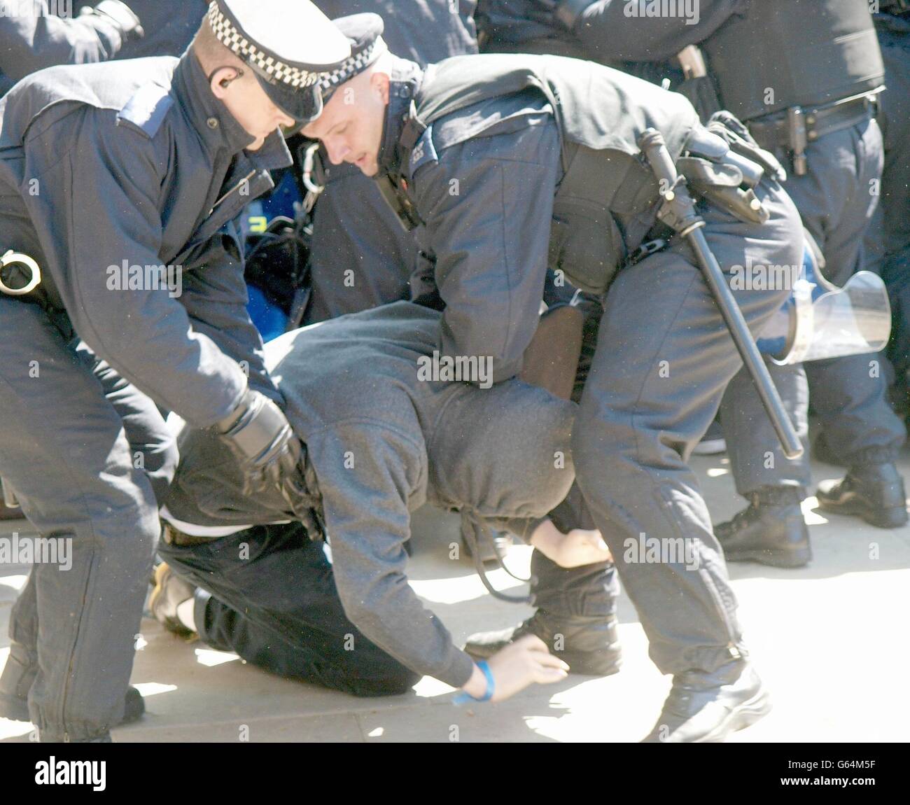 A UAF demonstrater is restrained outside Downing Street, during a face ...