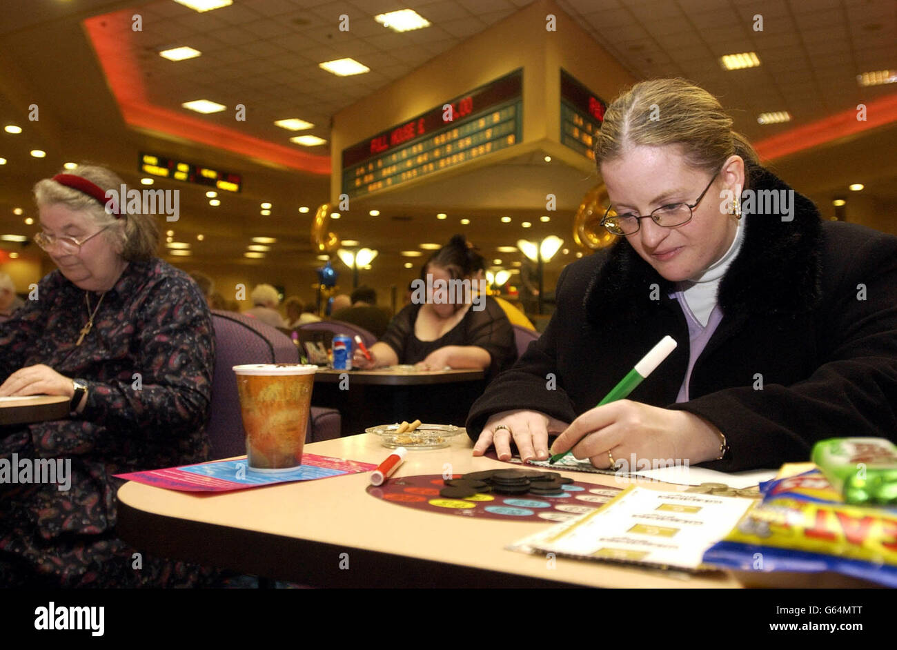 Bingo players at Mecca Bingo in Wandsworth, South London concentrate on ...